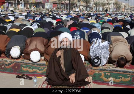 Iraqi worshippers pray during Friday prayers in the Shiite stronghold ...