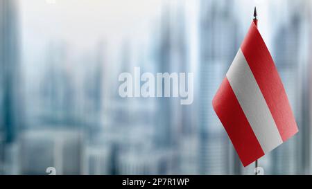 Small flags of the Austria on an abstract blurry background Stock Photo ...