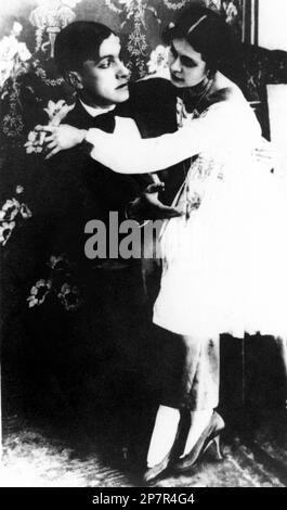 Portrait of Lilya Brik (1891-1978) in golden robe. The scarf designed ...