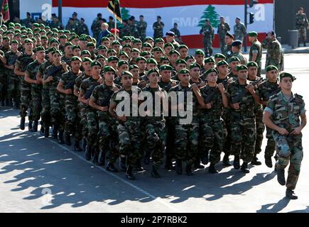 Lebanese army soldiers march during a military parade to mark the 73rd ...