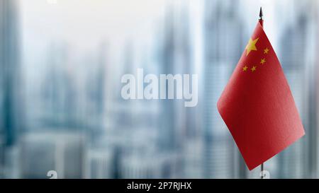 Small flags of the China on an abstract blurry background Stock Photo ...