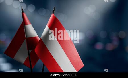 Small flags of the Austria on an abstract blurry background Stock Photo ...