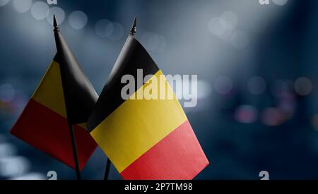 Small flags of the Belgium on an abstract blurry background Stock Photo ...