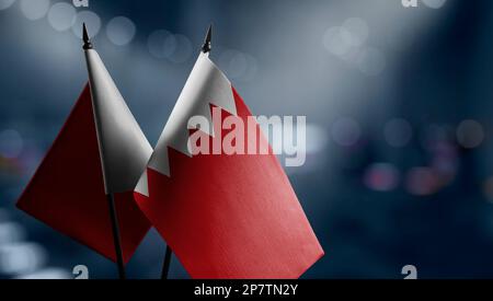 Small flags of the Bahrain on an abstract blurry background Stock Photo ...