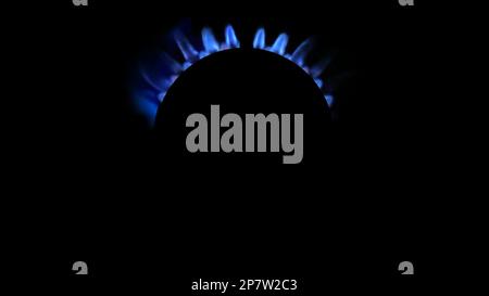 3D rendering of a kitchen burner glowing at night, close up. Natural ...