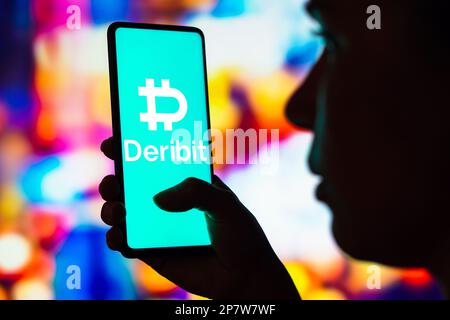 In this photo illustration, the Deribit logo seen displayed on a ...