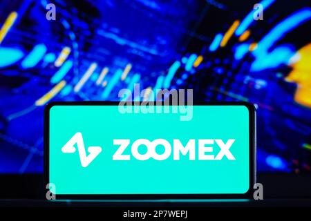 In this photo illustration, the Zoomex logo seen displayed on a ...