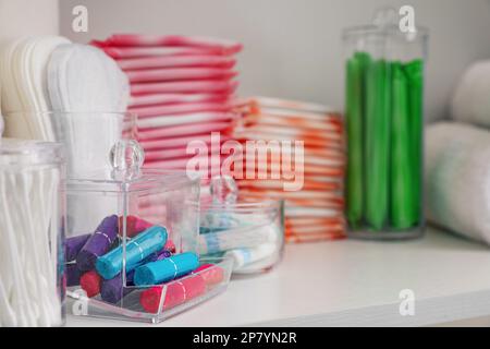 Storage of different feminine hygiene products in cabinet Stock Photo ...