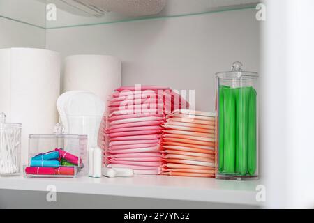 Storage of different feminine hygiene products in drawer indoors, top ...