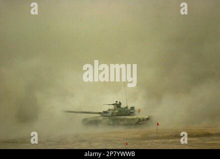 FILE - In this Oct. 1, 2009 file photo, military vehicles carrying the ...