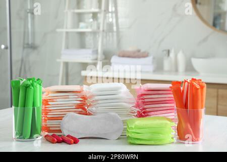 Different feminine hygiene products on dressing table in bedroom Stock ...