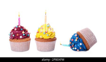 Dropped cupcake among good ones on white background. Troubles happen ...