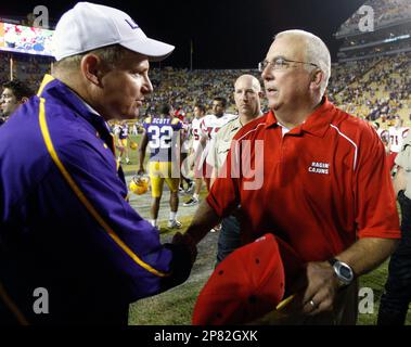 LSU coach Les Miles congratulates Florida quarterback Tim Tebow (15) on ...