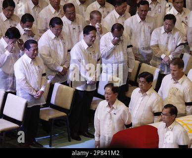 Members of the Iglesia ni Cristo, or Church of Christ, observe as their ...