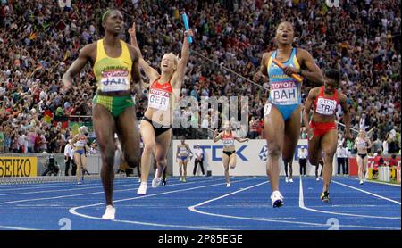Bahamas' Debbie Ferguson-McKenzie crosses the finish line to take the ...