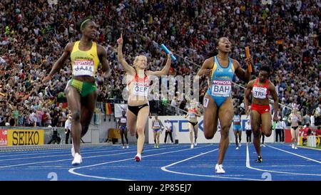 Bahamas' Debbie Ferguson-McKenzie crosses the finish line to take the ...