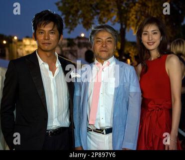 Japanese actor Yuji Oda, left, and actress Yuki Amami reacts during the ...
