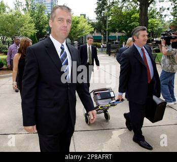 NASCAR driver Jeremy Mayfield, left, embraces his wife, Shana, right ...