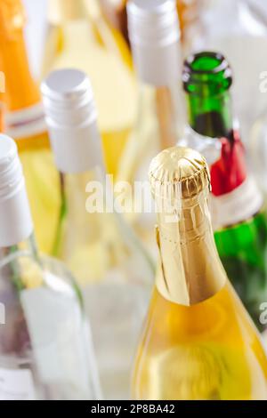 Full and empty bottles of different alcoholic drinks, abuse and alcohol ...