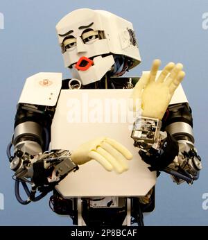 Humanoid robot KOBIAN displays an emotion of happiness during a ...