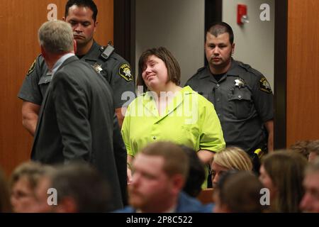 Korena Roberts enters the Washington County courtroom in Hillsboro, Ore ...