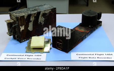 The cockpit voice recorder, left, and the flight data recorder from ...