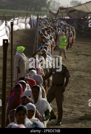 Indian Sikh devotees gather to pay obeisance at a Sikh temple as they ...