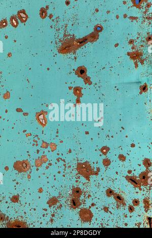 A metal gates is covered with splinter marks from exploding shells in ...