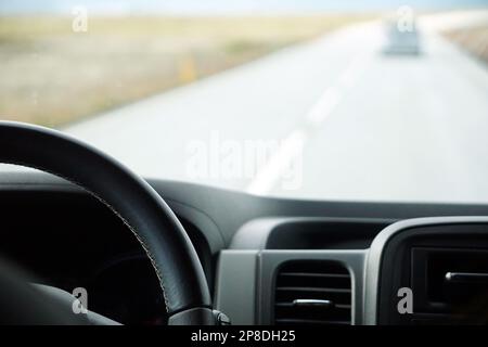 Driving a car - perspective of a driver - bokeh effect Stock Photo - Alamy
