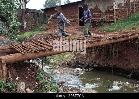 KENYA, Nairobi, Kibera slum, sewage canal / KENIA, Nairobi, Slum Kibera ...