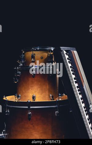 Drums and musical keys on a black background isolated Stock Photo - Alamy