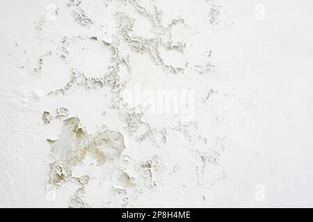Badly fixed building facade wall covered with cracks in stucco and ...
