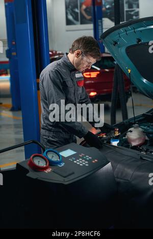 Mechanic conduct full technical inspection of air conditioner Stock ...