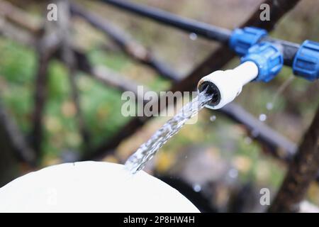 Polyethylene water pipes and clean water jet close-up Stock Photo - Alamy