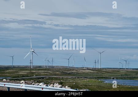 Wind farm in hilly area under cloudy sky Stock Photo - Alamy