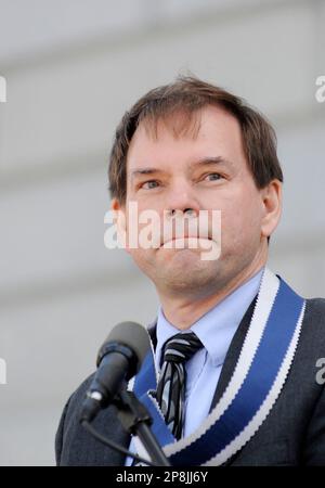 Tom Mauser, father of slain student Daniel Mauser, wears a button of ...