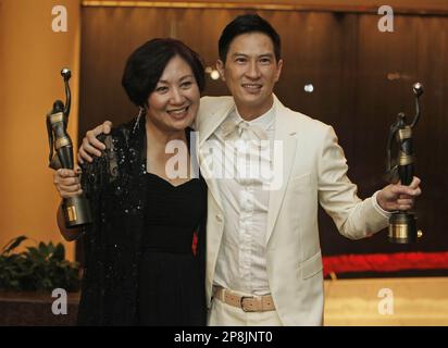 Hong Kong actress Paw Hee-ching, right, poses with her husband Fang ...