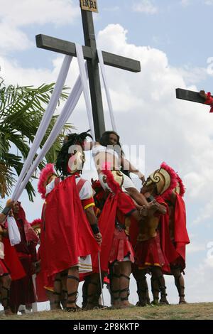 Ruben Enaje is nailed to the cross during a reenactment of Jesus Christ ...