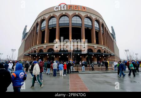 Baseball fans wait to enter Citi Field for an NCAA college baseball ...