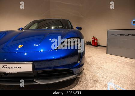 Circa 2023 - Sofia, Bulgaria: A blue shiny new Porsche Tacan car on ...