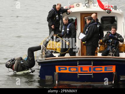 A Metropolitan Police diving team carry out a security search of the ...