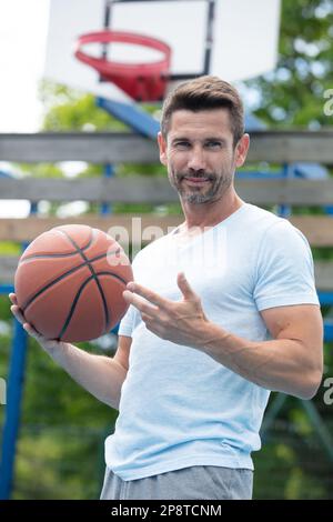 handsome male playing basketball outdoor Stock Photo - Alamy