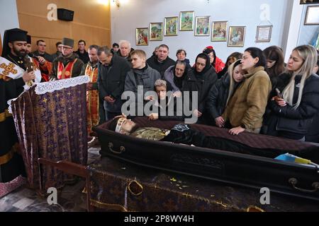 IVANO-FRANKIVSK REGION, UKRAINE - MARCH 09, 2023 - A cross wrapped in a ...