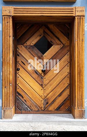 Old door of a historical building with steel door fittings Stock Photo ...