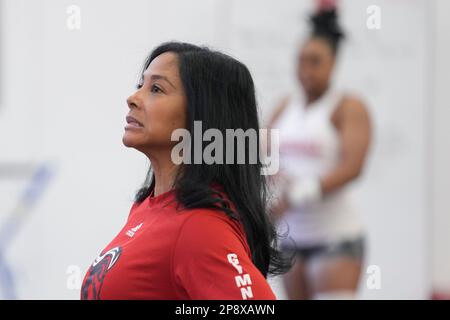 Rutgers women’s gymnastics coach Umme Salim-Beasley spots a student ...