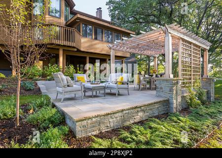Pergola and bluestone patio in backyard creates outdoor space for ...