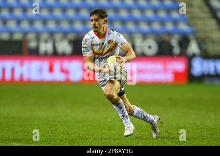 Arthur Mourgue #1 of Catalans Dragons is tackled by Ethan Havard #16 of ...