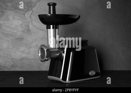 Modern electric meat grinder on marble table. Space for text Stock ...