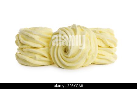 Many delicious yellow zephyrs on white background Stock Photo - Alamy