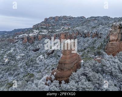 Aerial view of the snowy Cavall Bernat of Matadepera rock, in La Mola ...
